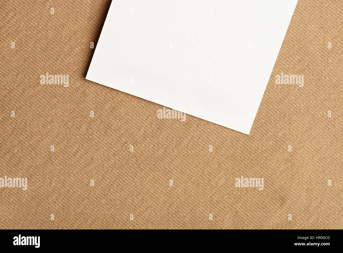 White paper tag on yellow brown cloth fabric textile background Stock ...