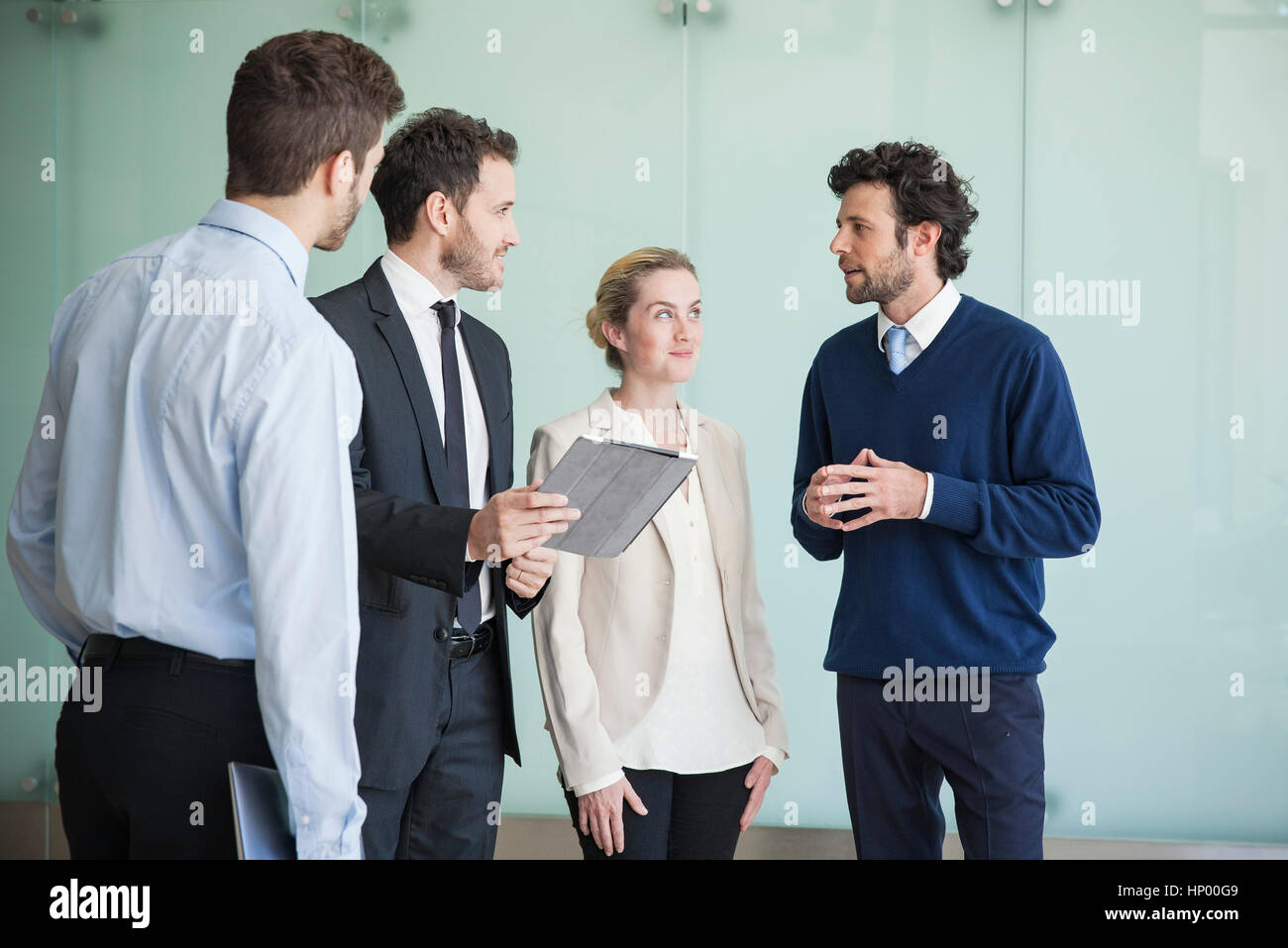 Collaborating professionals sharing ideas hi-res stock photography and ...