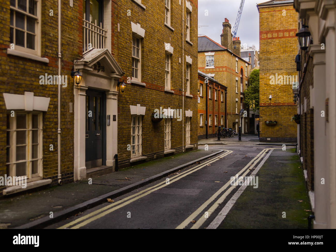 narrow street in the old style, with brick buildings, historical place ...