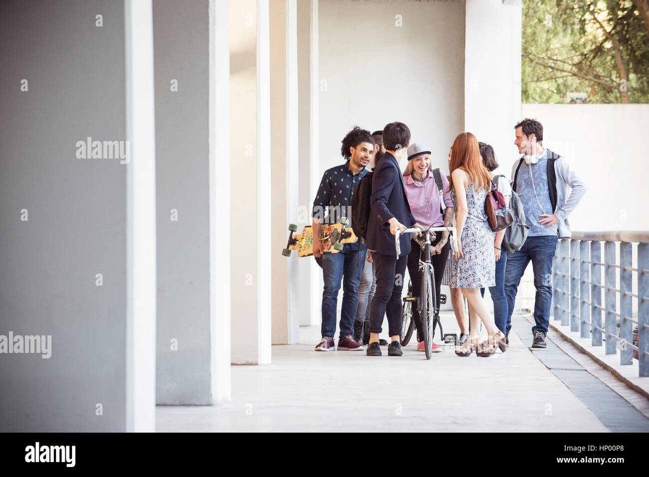 Group of college students chatting together after class Stock Photo - Alamy