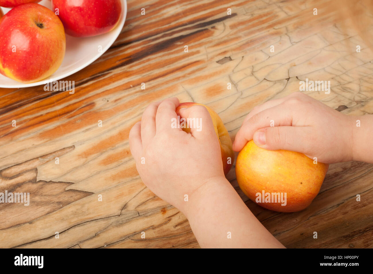 A little child is getting apples Stock Photo - Alamy