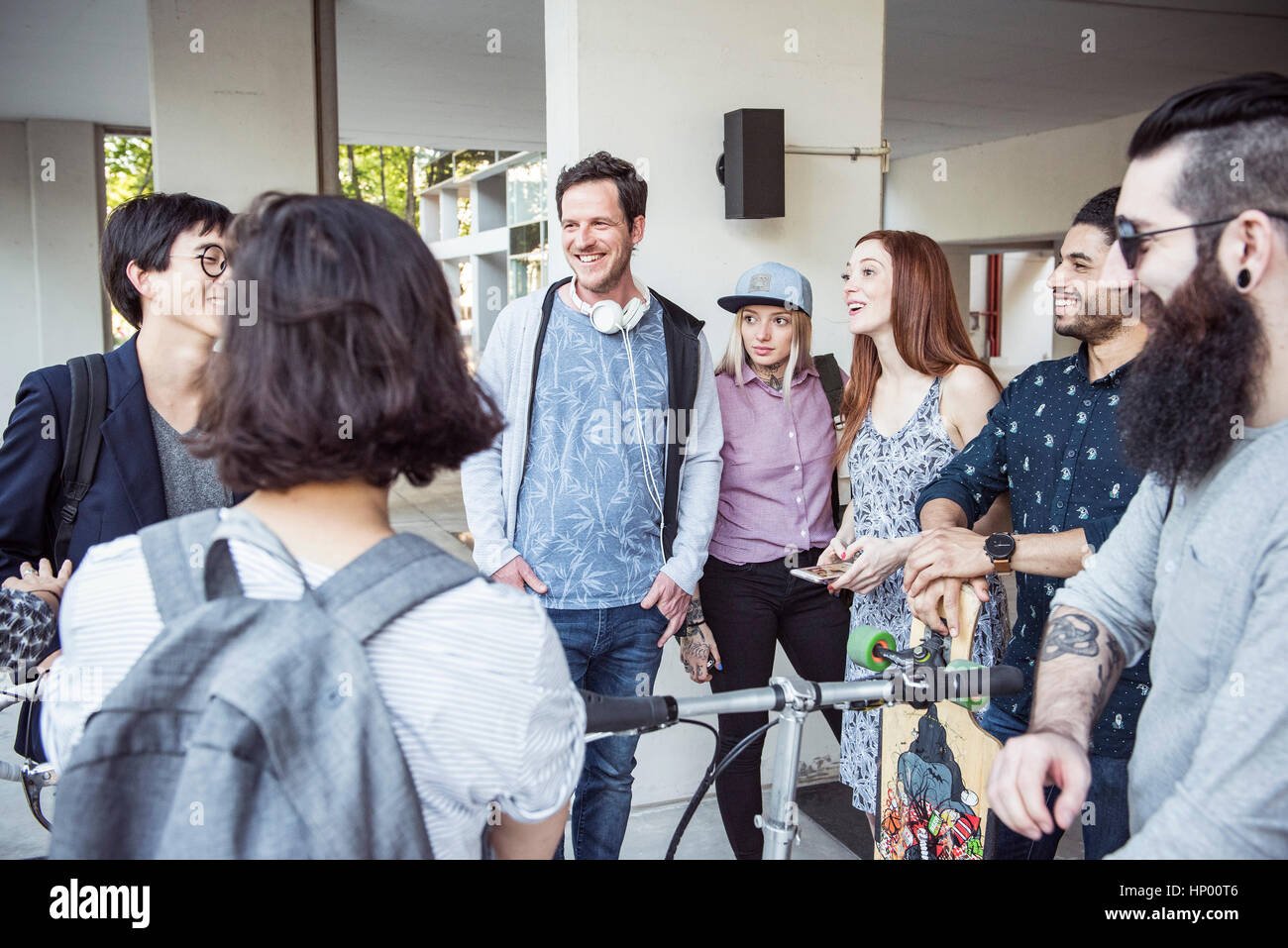 Group of colleagues chatting together outdoors Stock Photo - Alamy