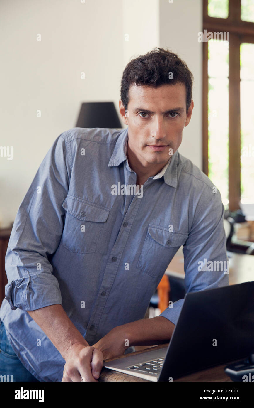 Man with laptop computer, portrait Stock Photo - Alamy