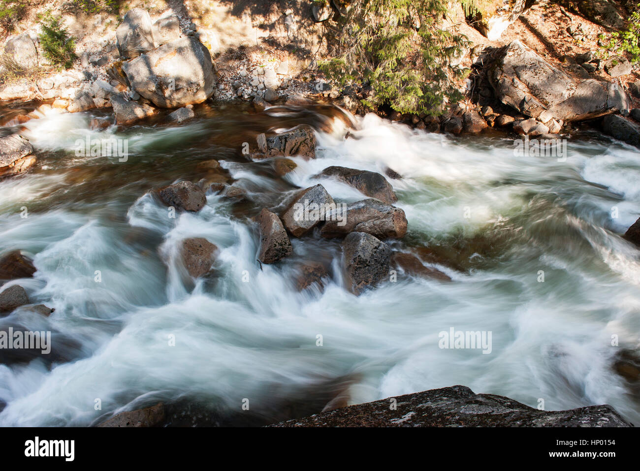 Stream flowing over rocks Stock Photo - Alamy