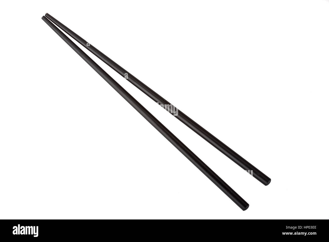 Black chopsticks isolated on white background Stock Photo - Alamy