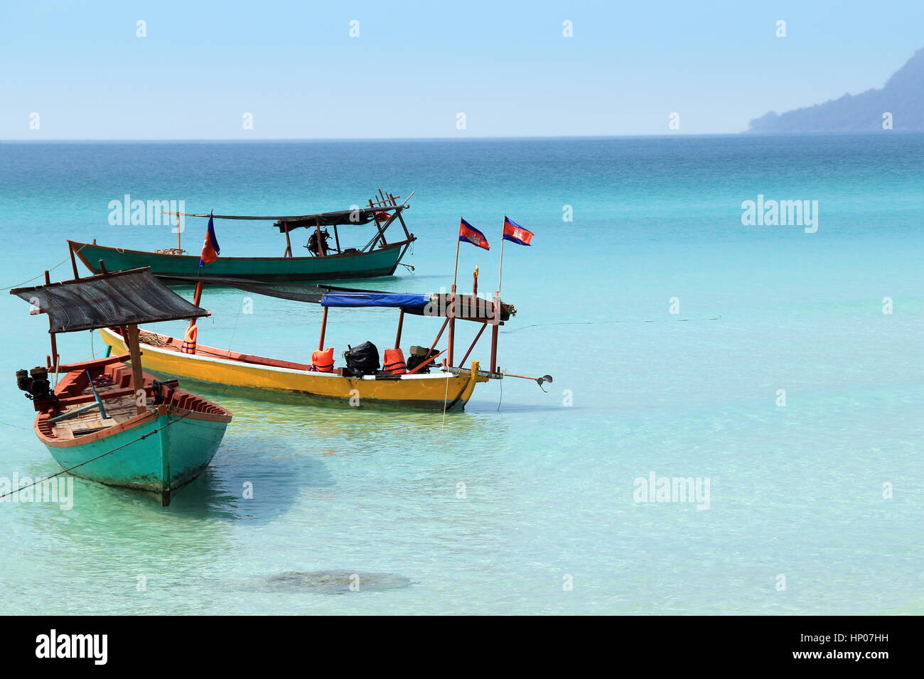 Three Cambodian boats with flags, Koh Rong Island Stock Photo - Alamy