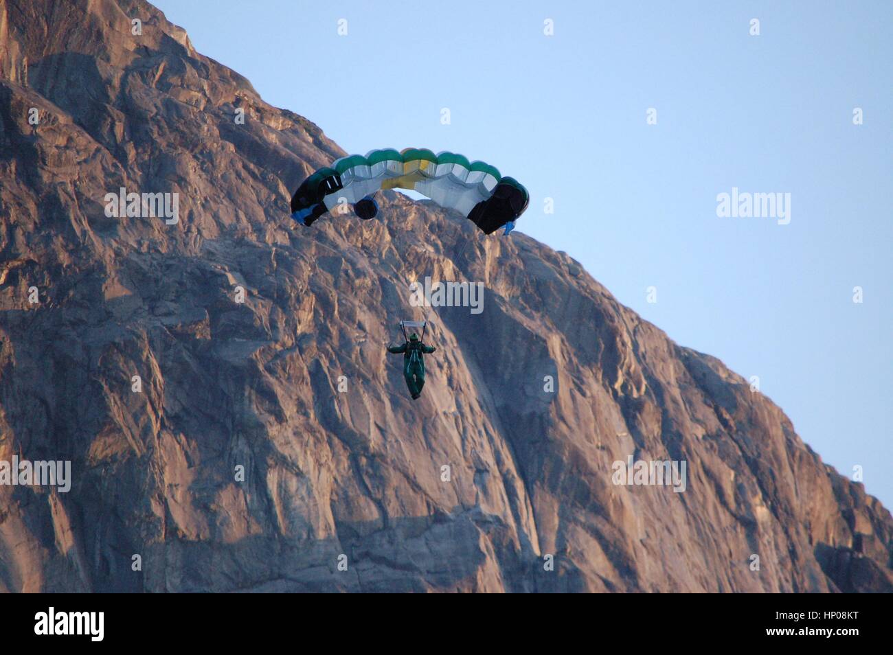 BASE jumpers launching themselves off of the cliffs of Kjerag in ...