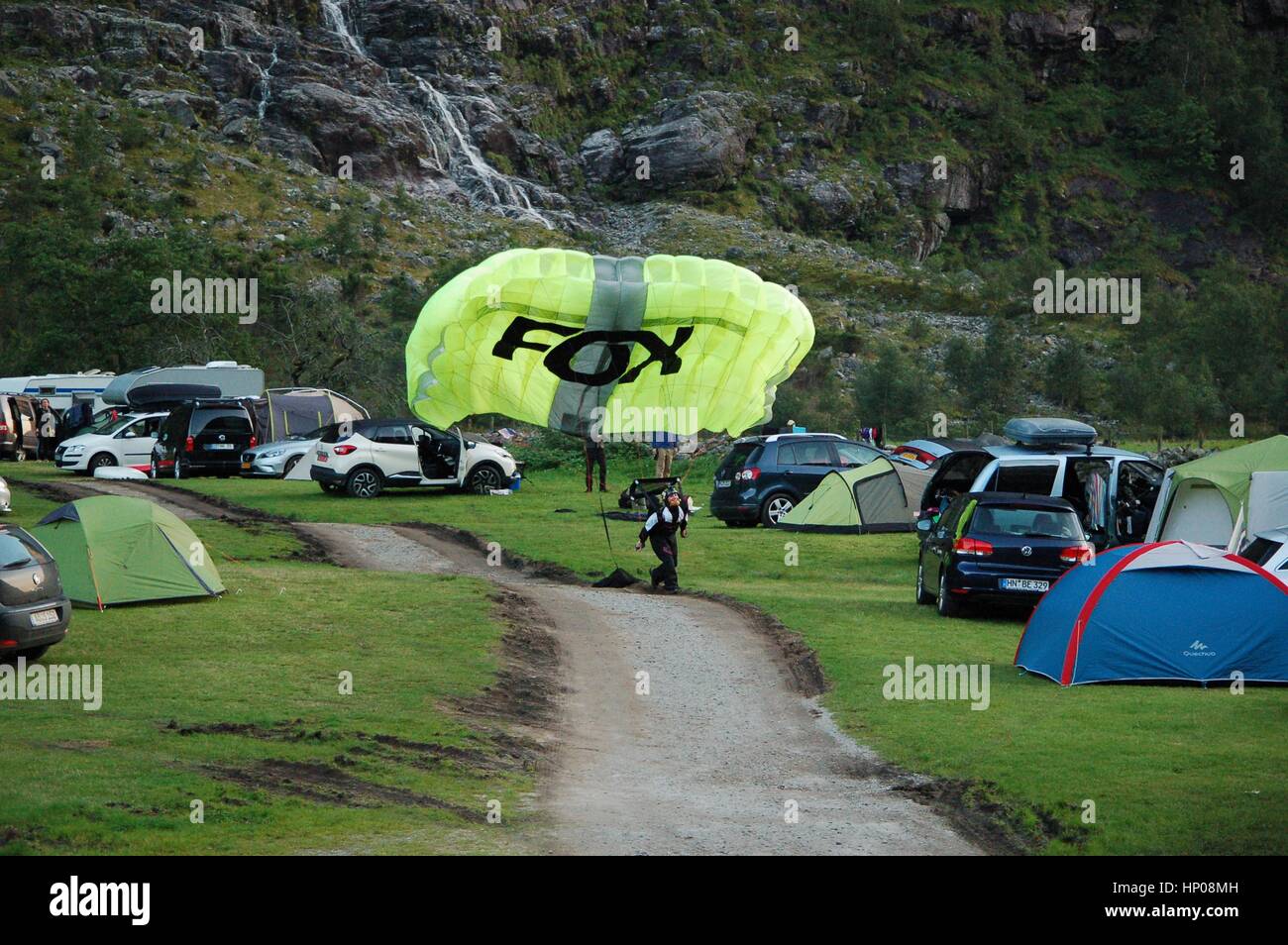 BASE jumpers launching themselves off of the cliffs of Kjerag in ...