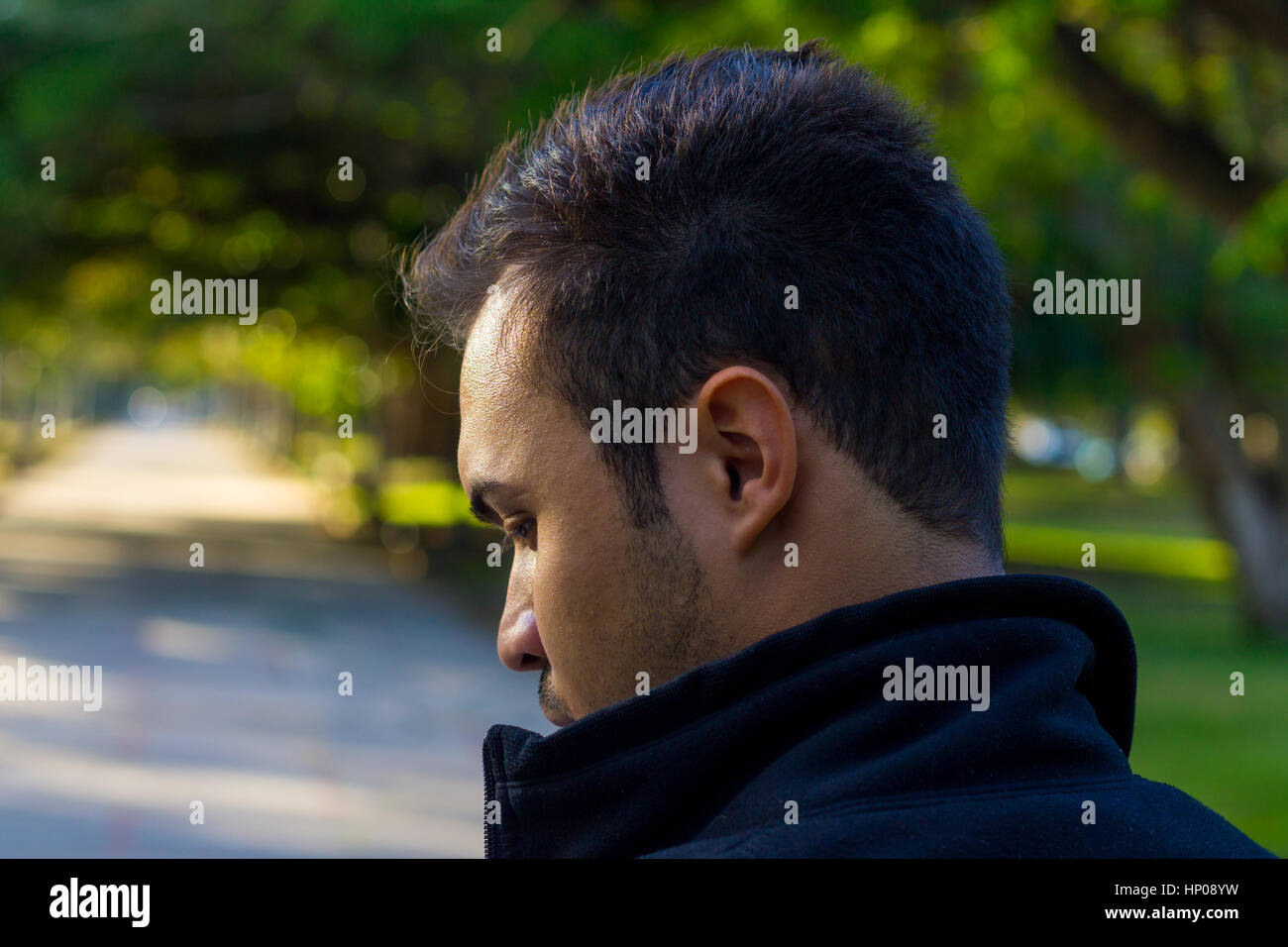 Guy at a park Stock Photo - Alamy