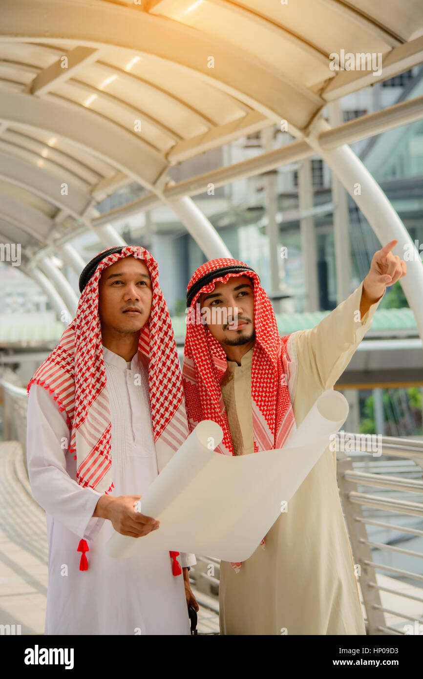 Arab Business people having consultanting about new project with city ...