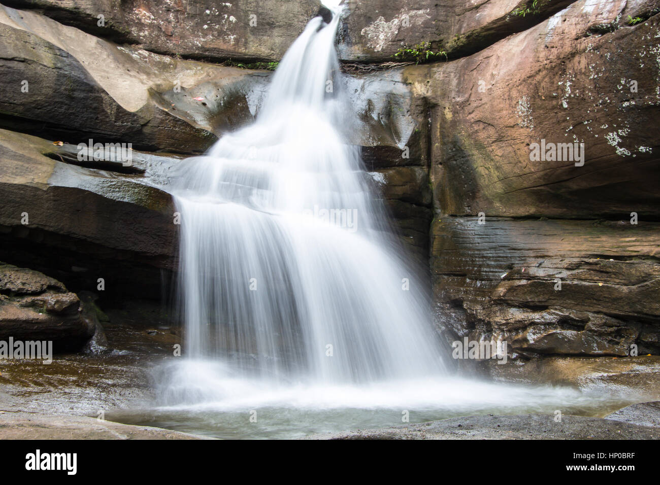 Waterfall with rock Stock Photo - Alamy
