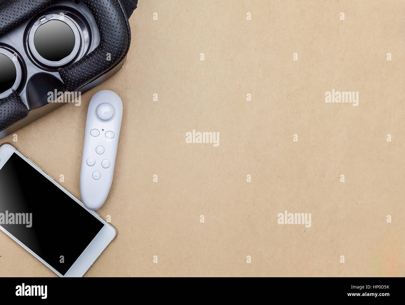 virtual glasses and joy stick on brown paper background Stock Photo - Alamy