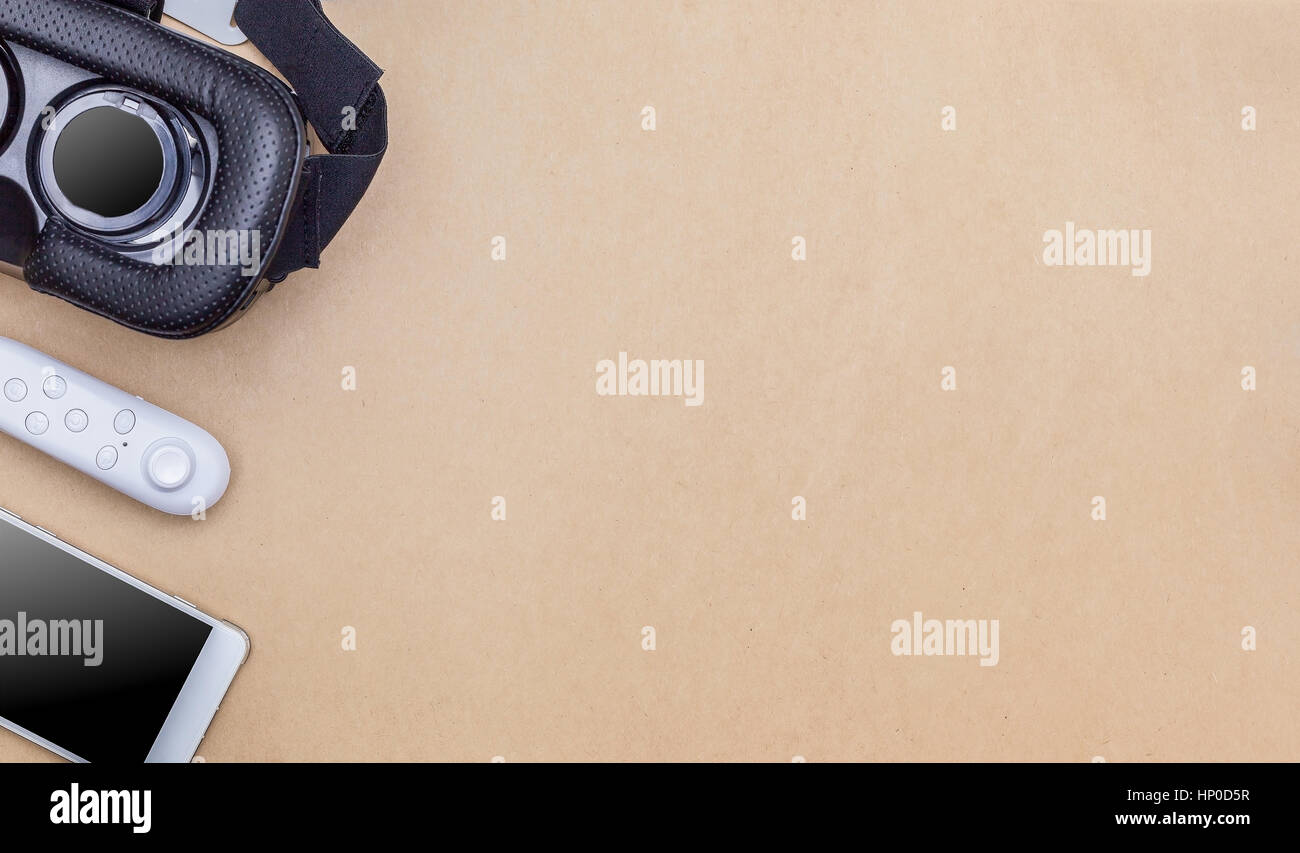 virtual glasses and joy stick on brown paper background Stock Photo - Alamy