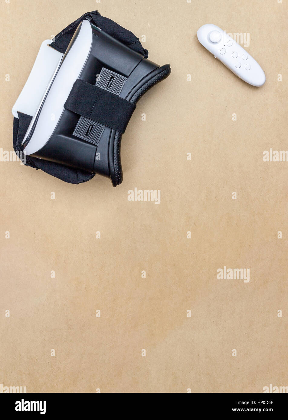 3d virtual glasses and bluetooth joy stick on brown paper background ...