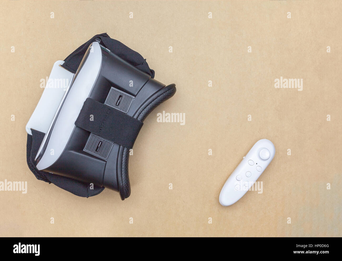 3d virtual glasses and bluetooth joy stick on brown paper background ...