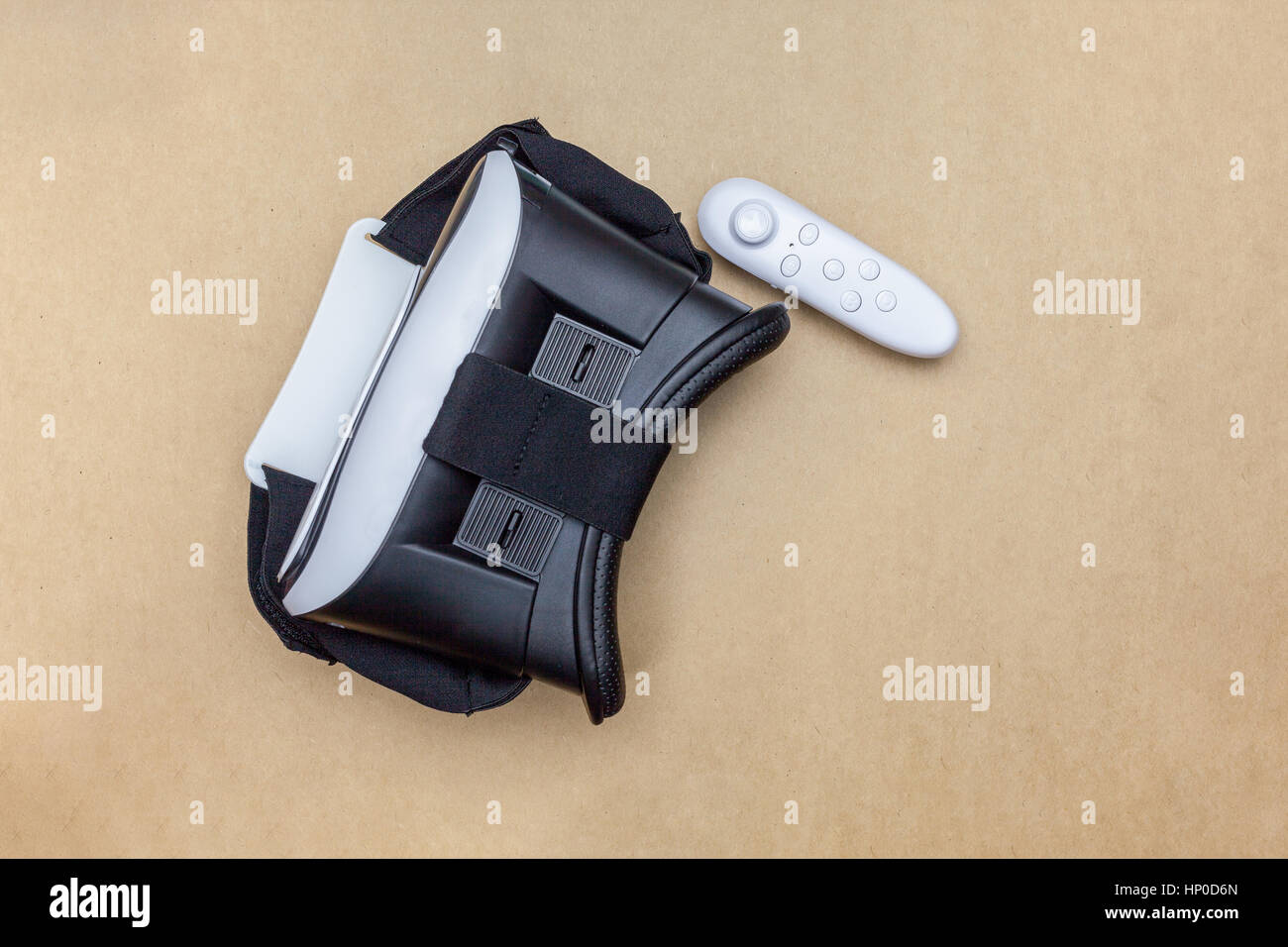 3d virtual glasses and bluetooth joy stick on brown paper background ...