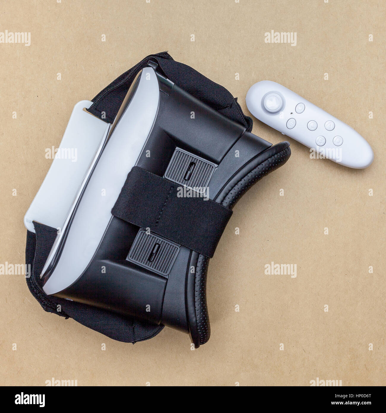 3d virtual glasses and bluetooth joy stick on brown paper background ...