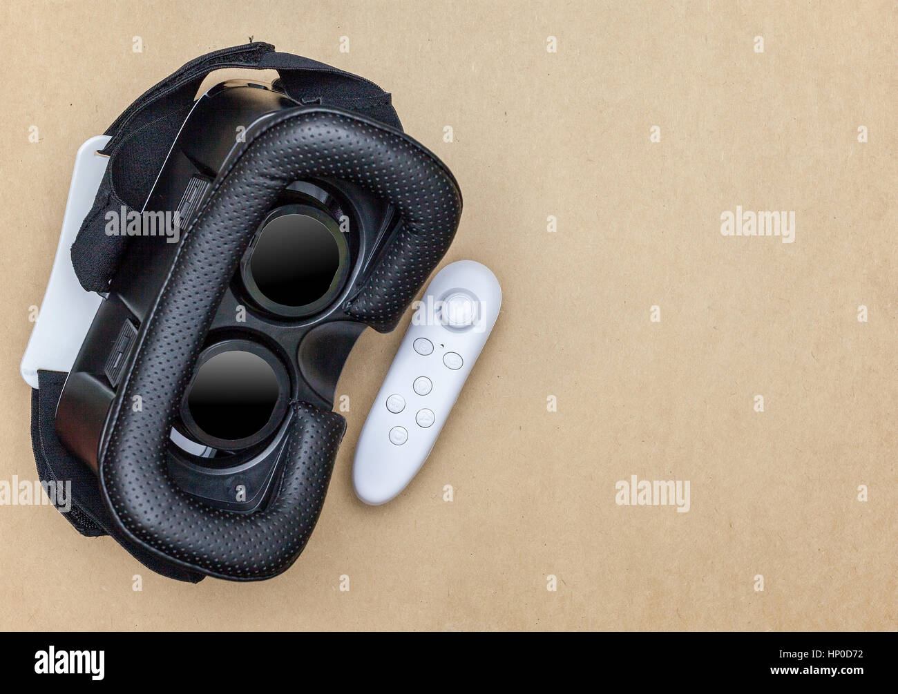 3d virtual glasses and bluetooth joy stick on brown paper background ...
