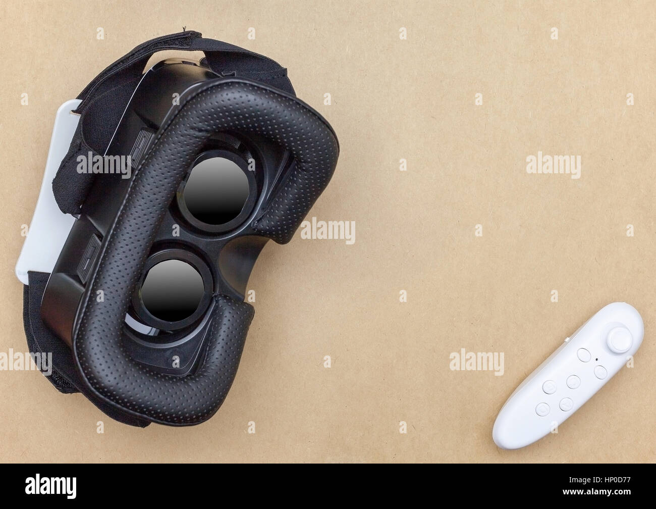 3d virtual glasses and bluetooth joy stick on brown paper background ...