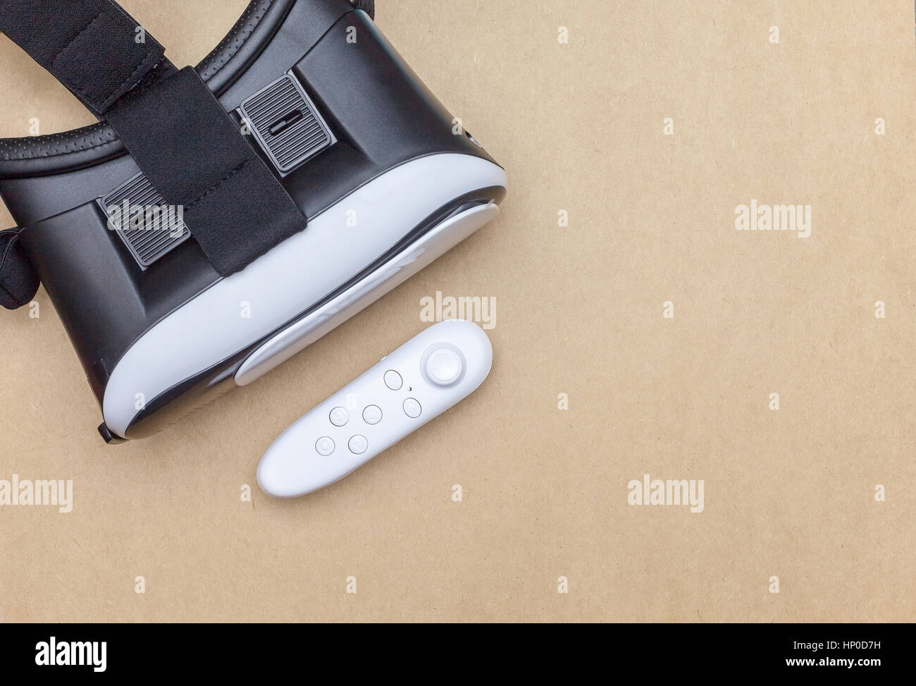 3d virtual glasses and bluetooth joy stick on brown paper background ...