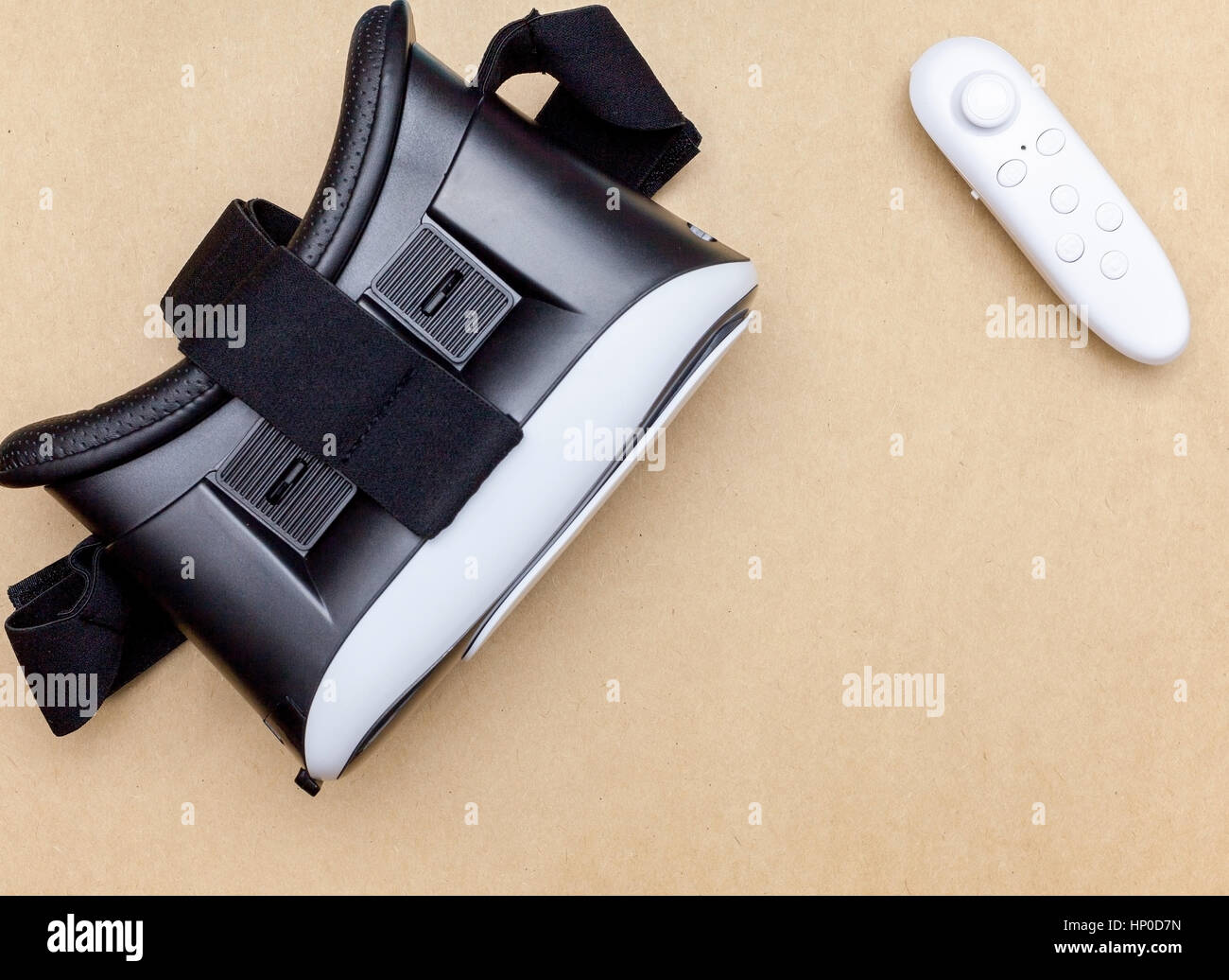3d virtual glasses and bluetooth joy stick on brown paper background ...
