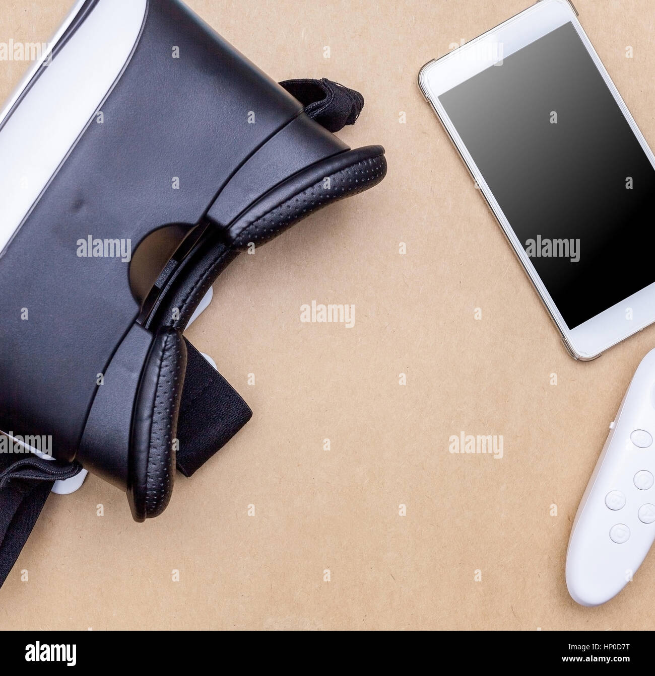 virtual glasses and joy stick on brown paper background Stock Photo - Alamy