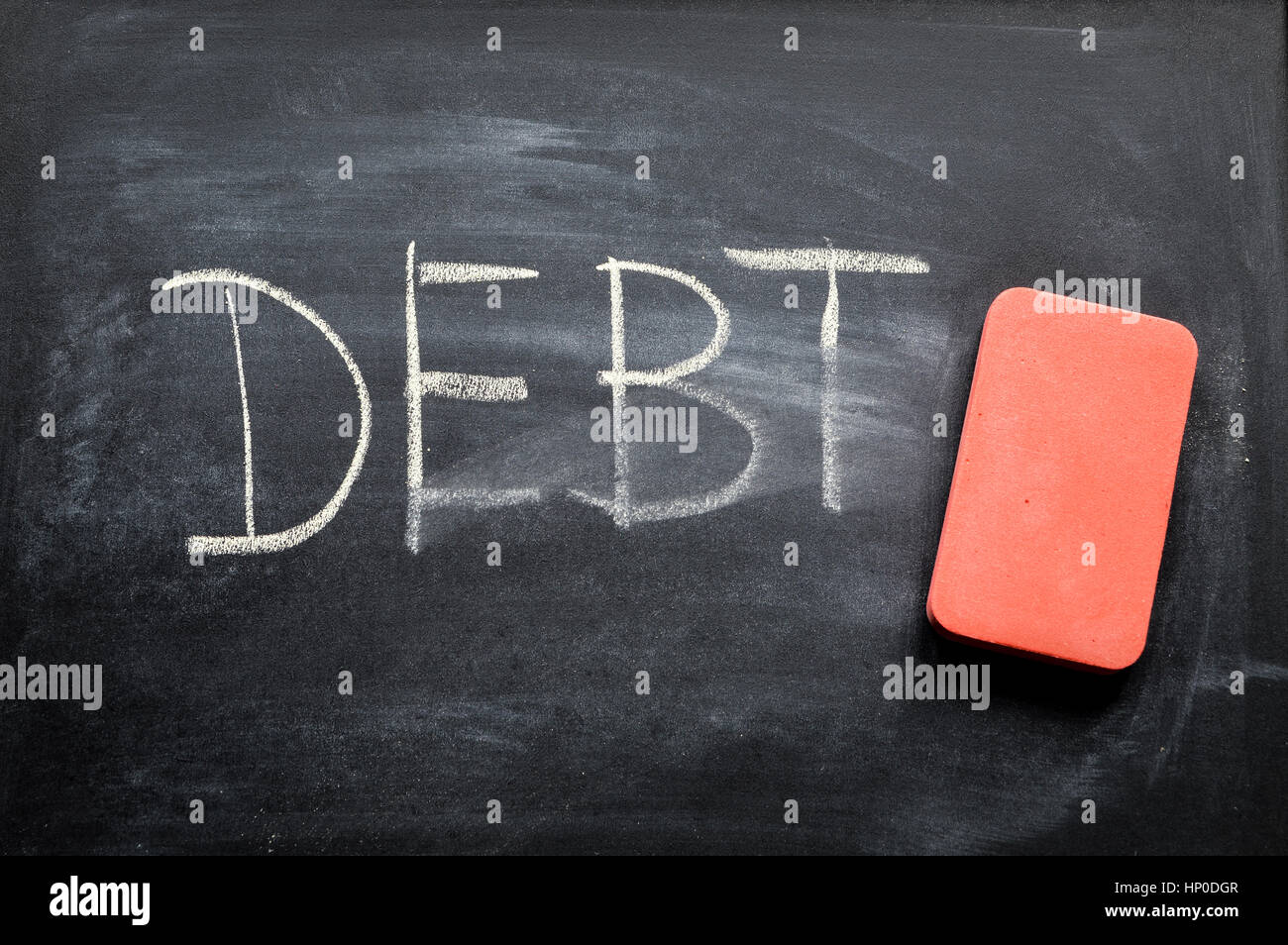 erasing debt, hand written word on blackboard being erased concept ...