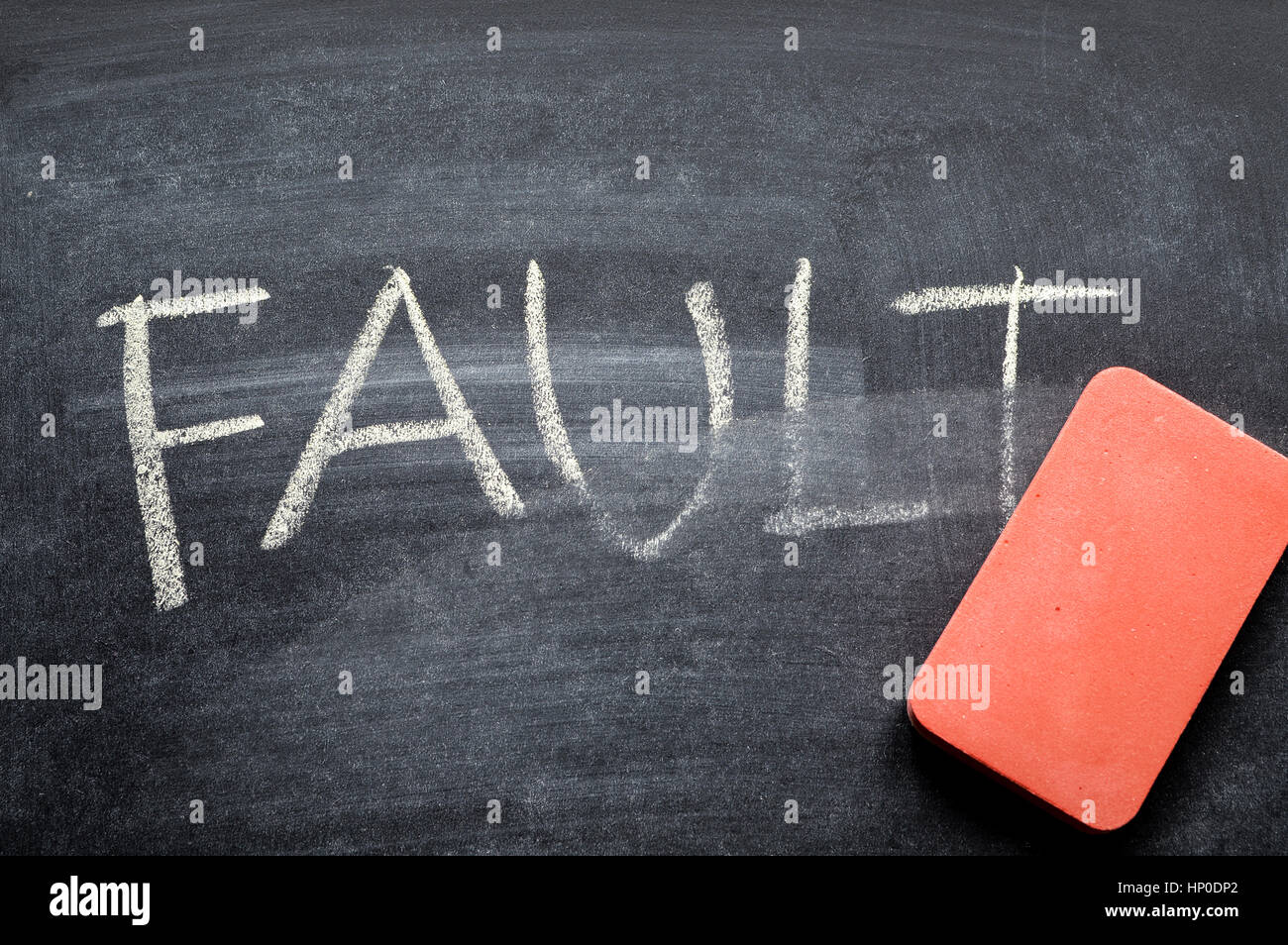 erasing fault, hand written word on blackboard being erased concept ...