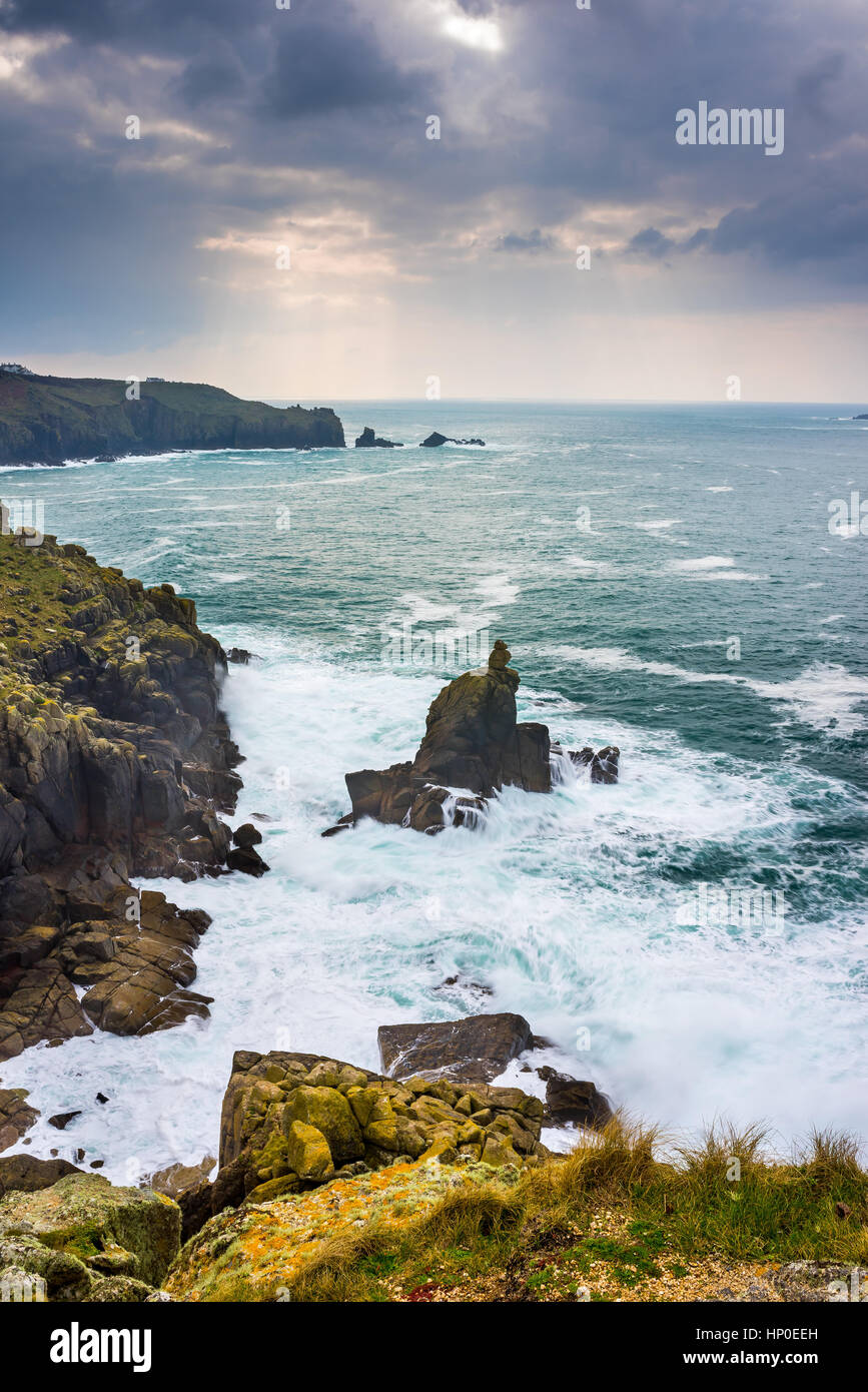 Overlooking crashing waves and the Irish Lady rock formation at Sennen ...