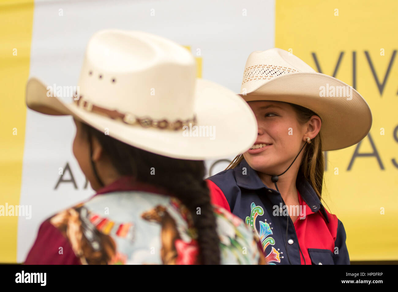 Cowgirl smiling and talking. Female rodeo competition celebrated in the ...