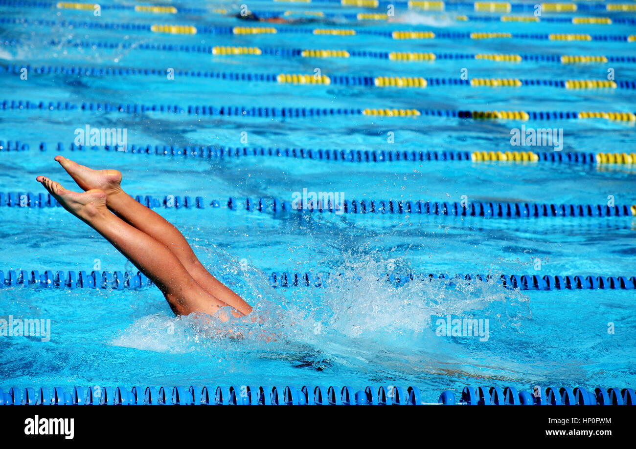 female swimmer diving into pool Stock Photo - Alamy