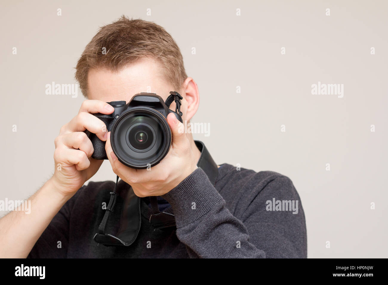 photographer taking picture with white background Stock Photo - Alamy