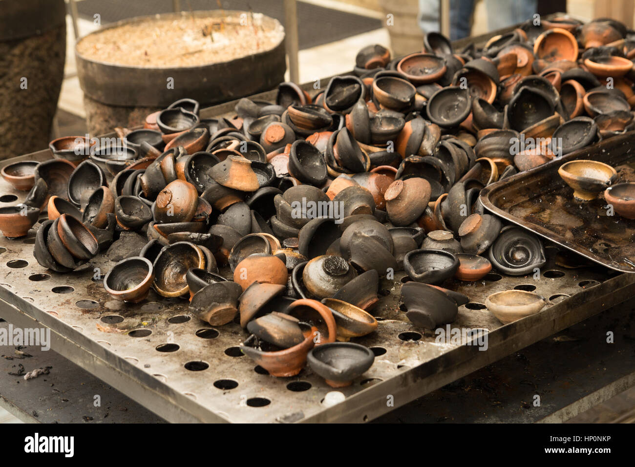 burned clay oil lamps in temple Stock Photo - Alamy