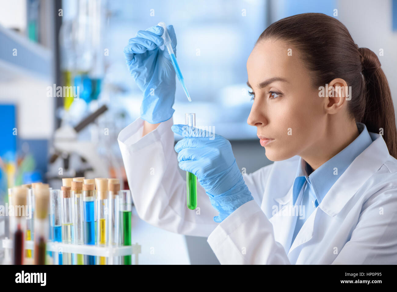 concentrated scientist working with laboratory tube Stock Photo - Alamy