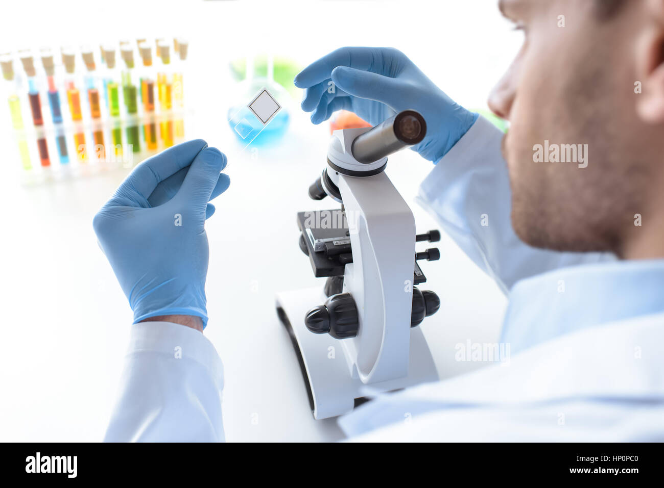 scientist working with microscope in laboratory Stock Photo - Alamy