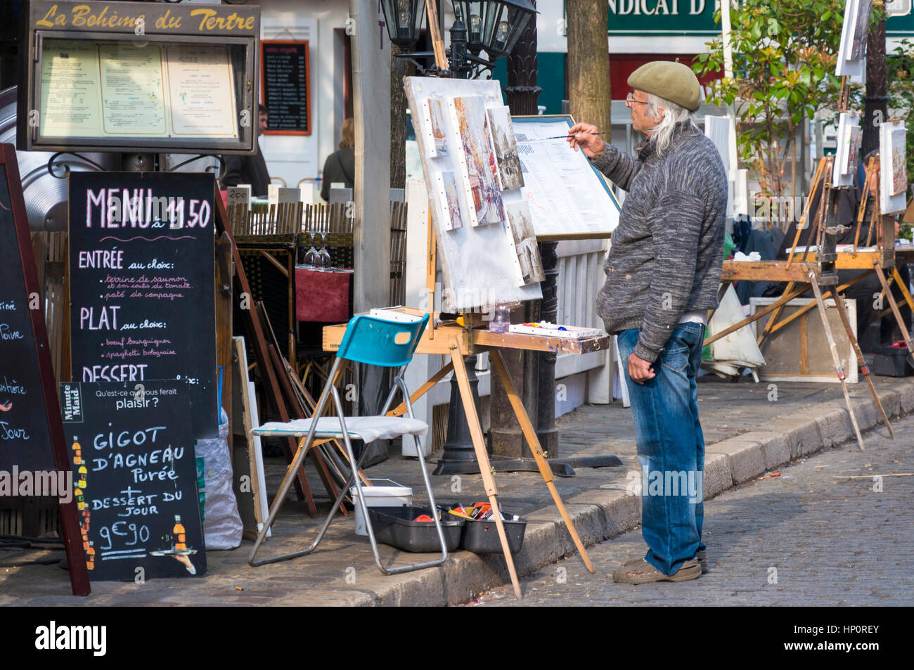 An artist painter at work in Place du Tertre, 18th arrondissement Paris ...
