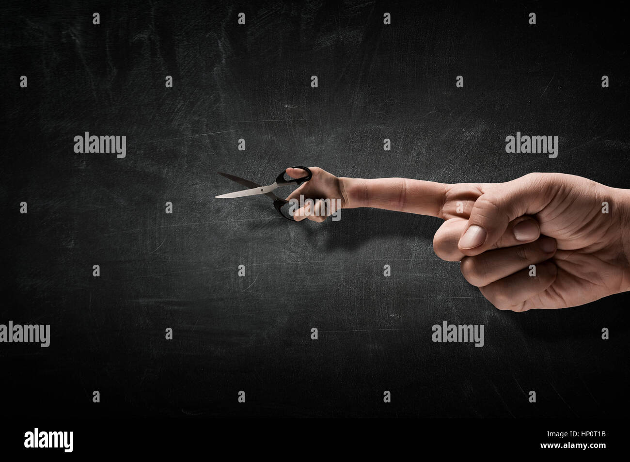 Person hand and scissors on concrete dark background Stock Photo - Alamy