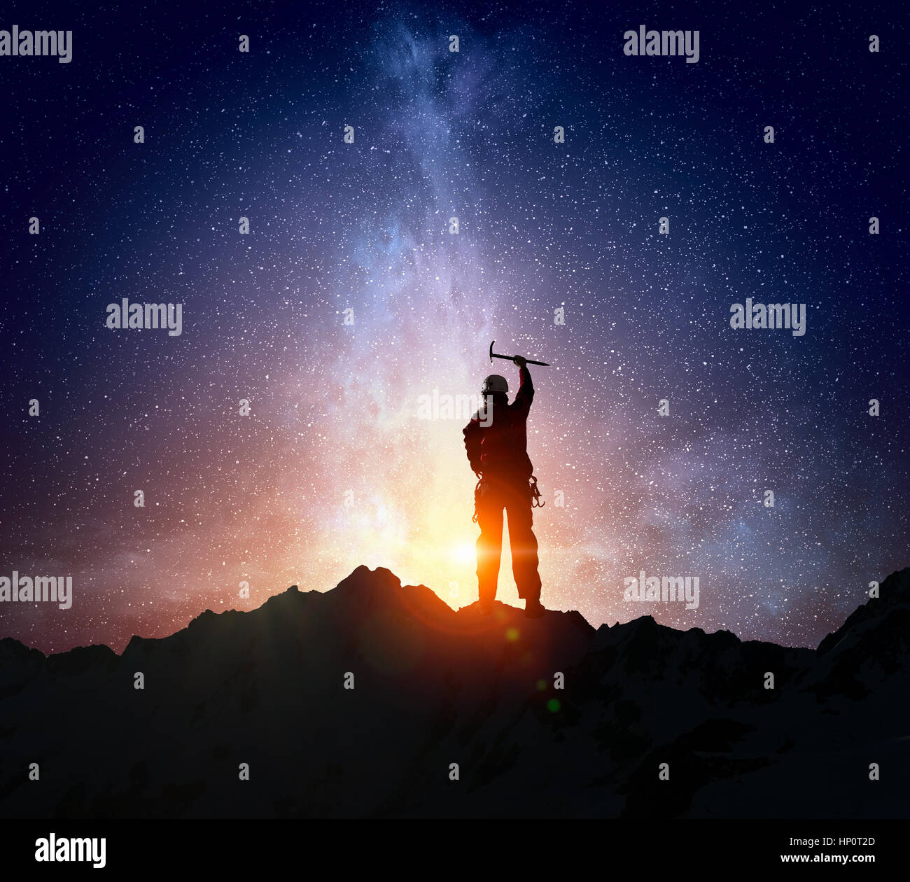 Young brave man alpinist standing on mountain top at night Stock Photo ...