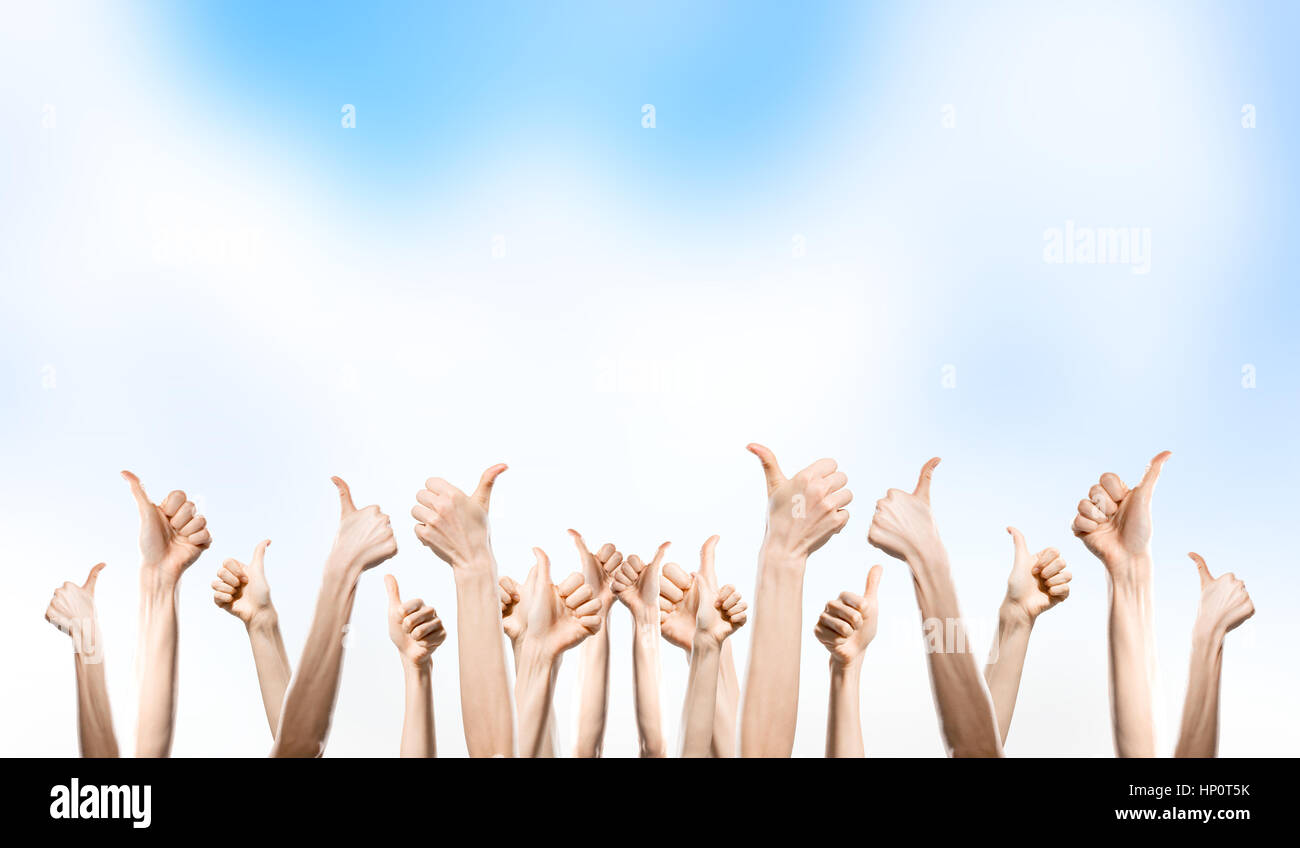 Row of raised hands showing different gestures Stock Photo - Alamy