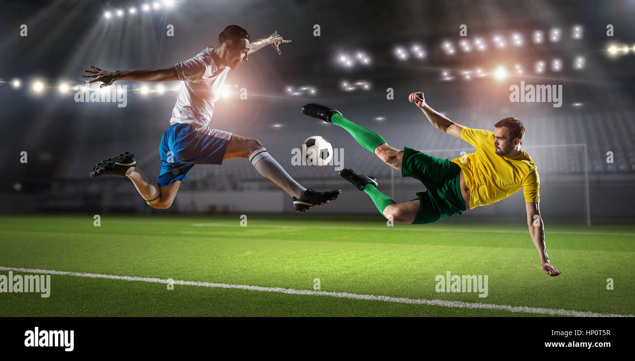 Soccer players in action on stadium fighting for ball. Mixed media ...