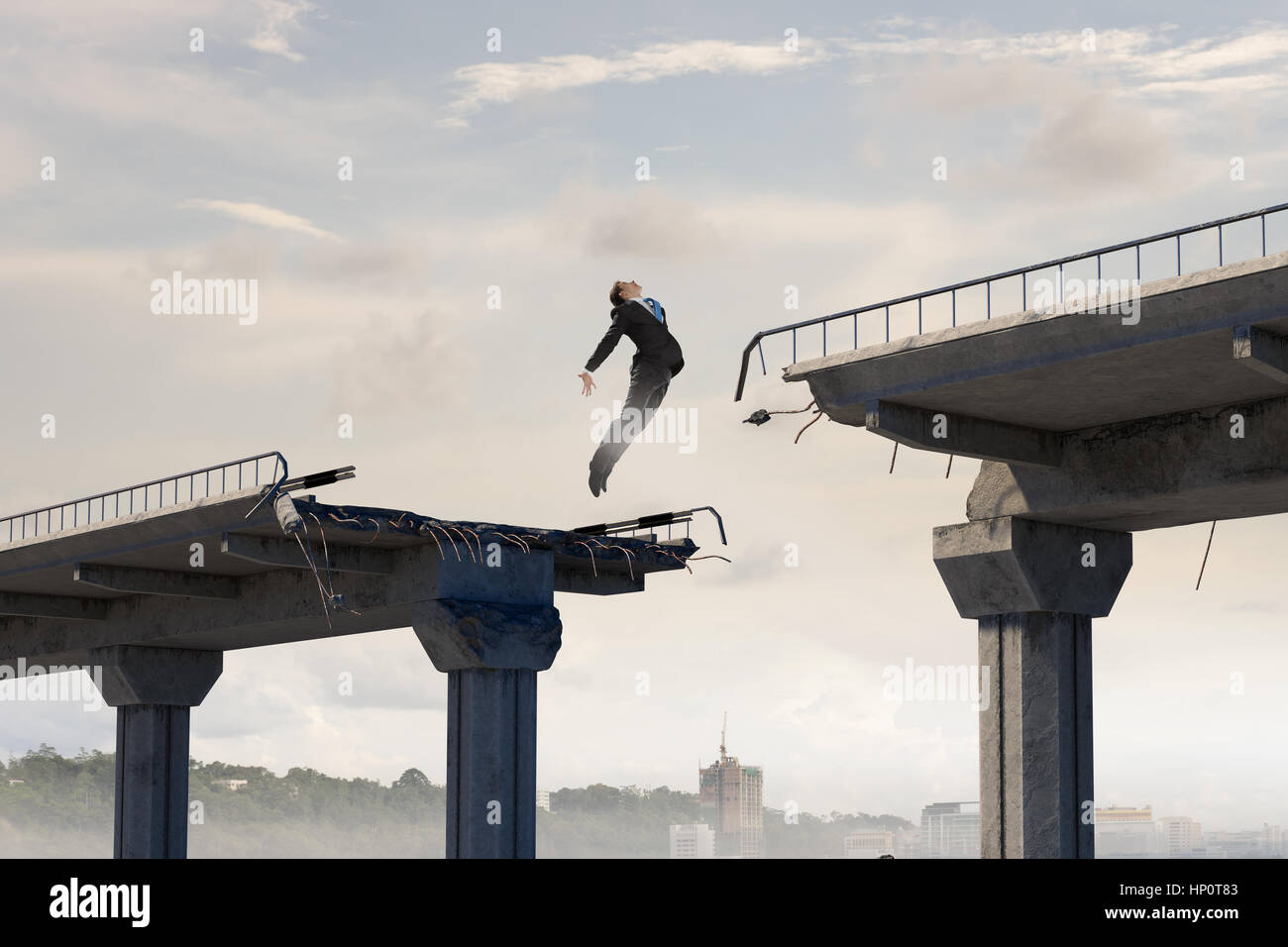 Businessman jumping over a gap in bridge as symbol of problem ...