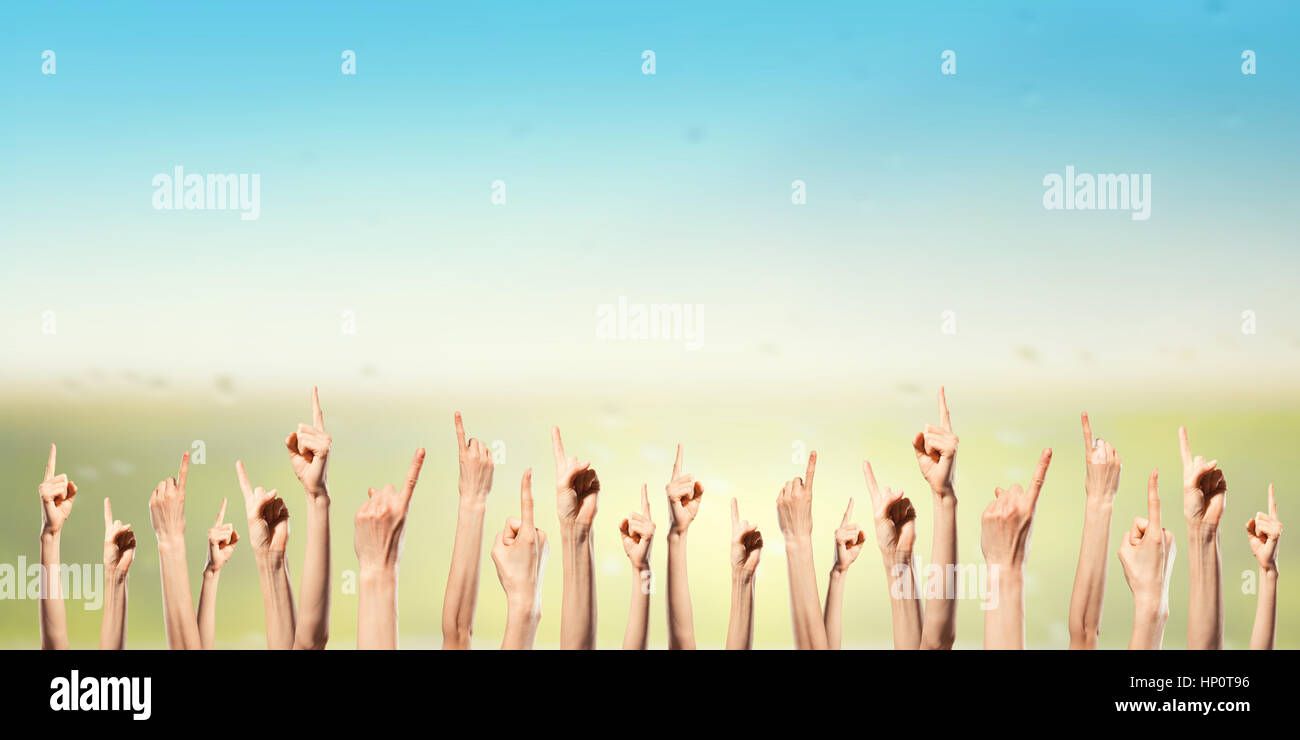 Row of raised hands showing different gestures Stock Photo - Alamy