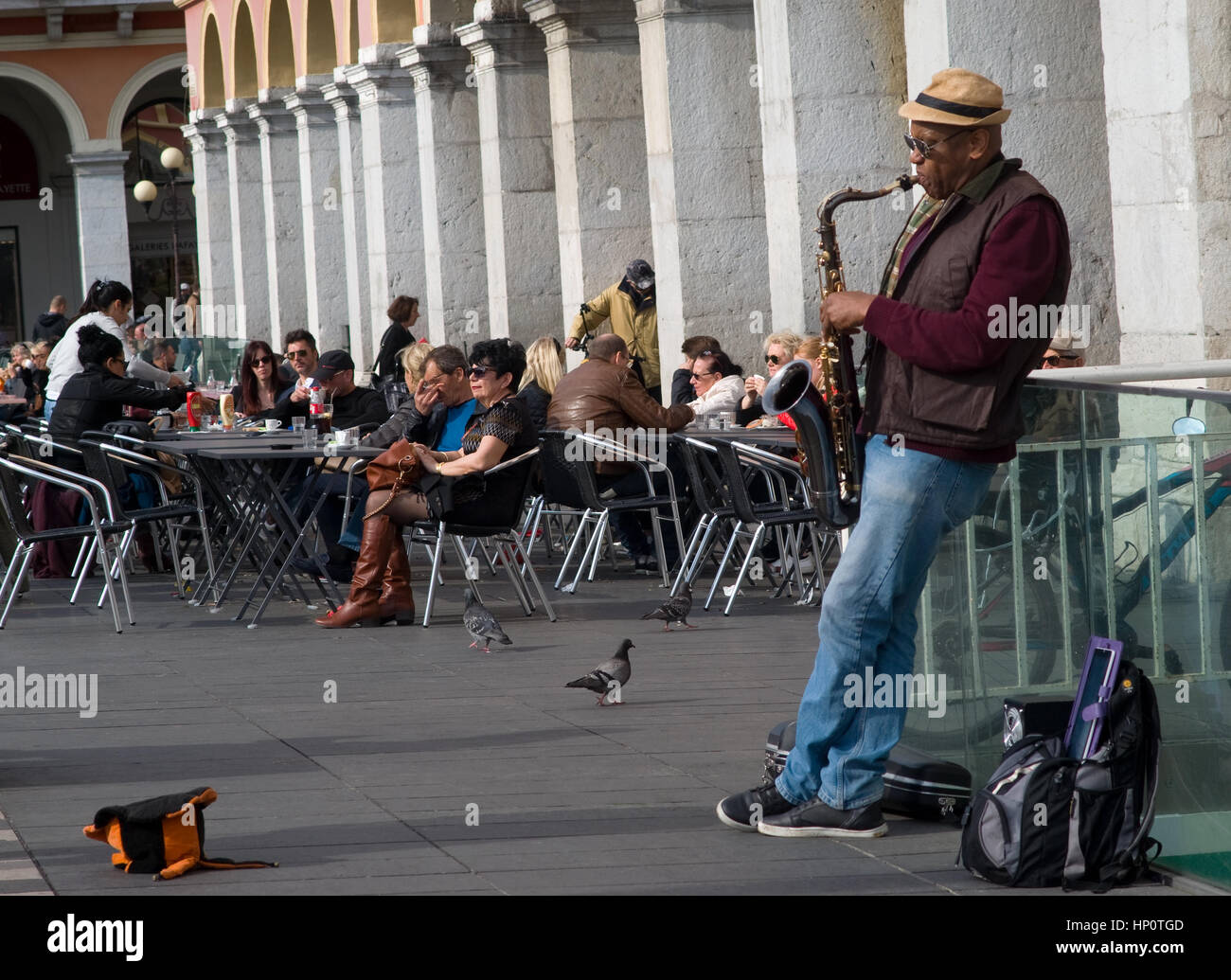 An artist busker playing jazz saxophone on the Massena Square, Nice ...