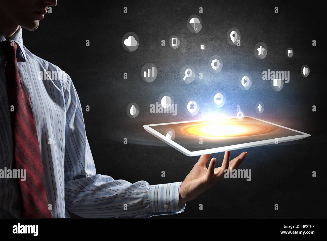 Hand of business person presenting tablet and it's media interface ...