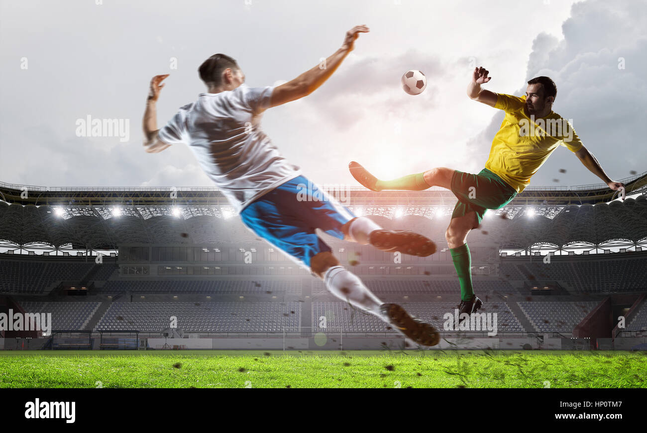 Soccer players in action on stadium fighting for ball. Mixed media ...