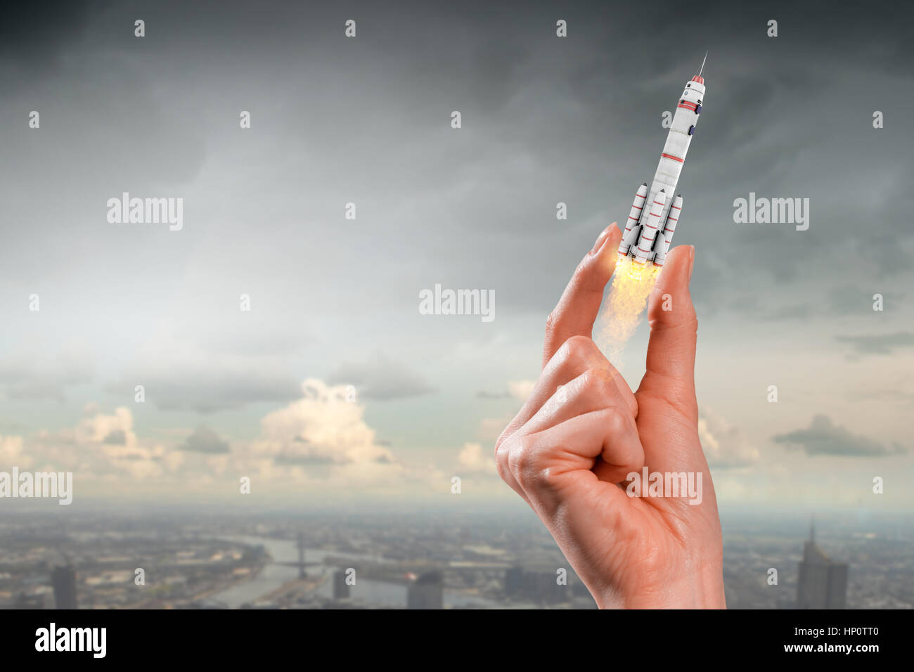 Close of hand catching flying rocket with fingers Stock Photo - Alamy