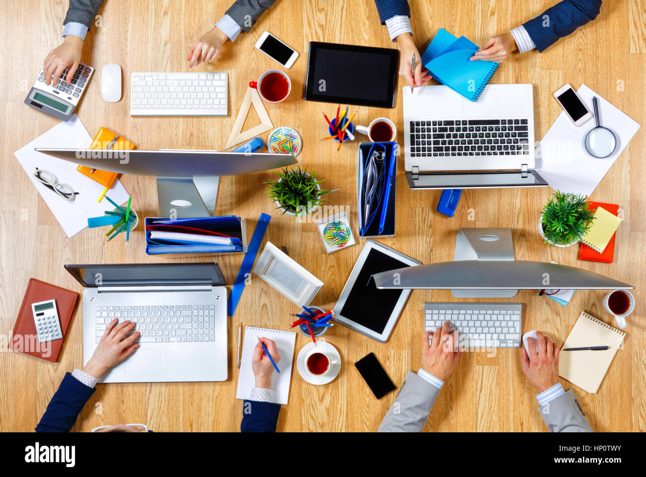Top view of office table with four colleagues working together Stock ...