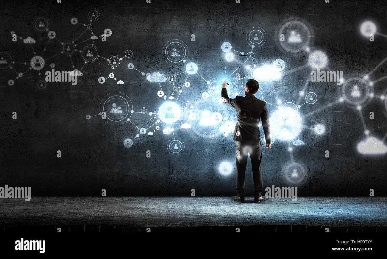 Back view of businessman drawing connection lines on wall. 3D rendering ...