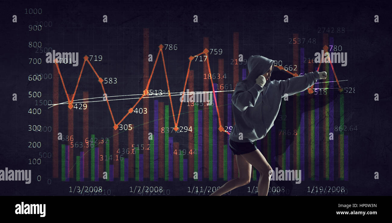 Young woman boxing against graphs background. Mixed media Stock Photo ...