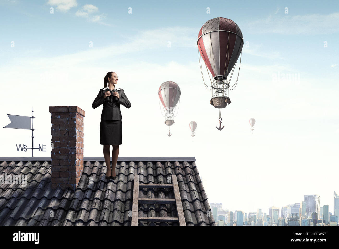 Career woman on roof looking in binoculars over city Stock Photo - Alamy